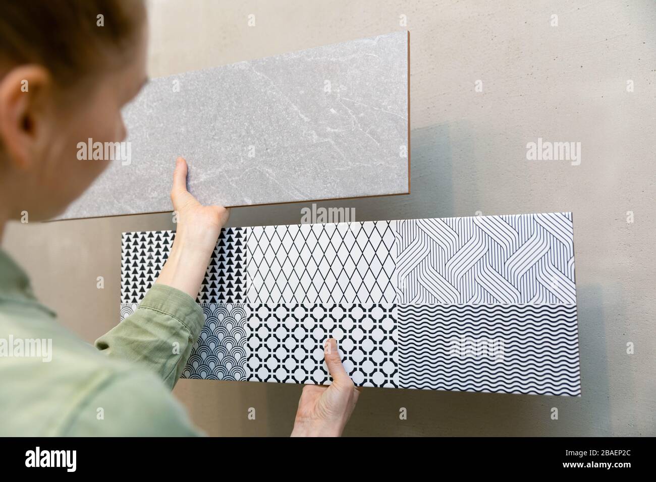 woman choosing wall tiles for her new bathroom interior design Stock ...