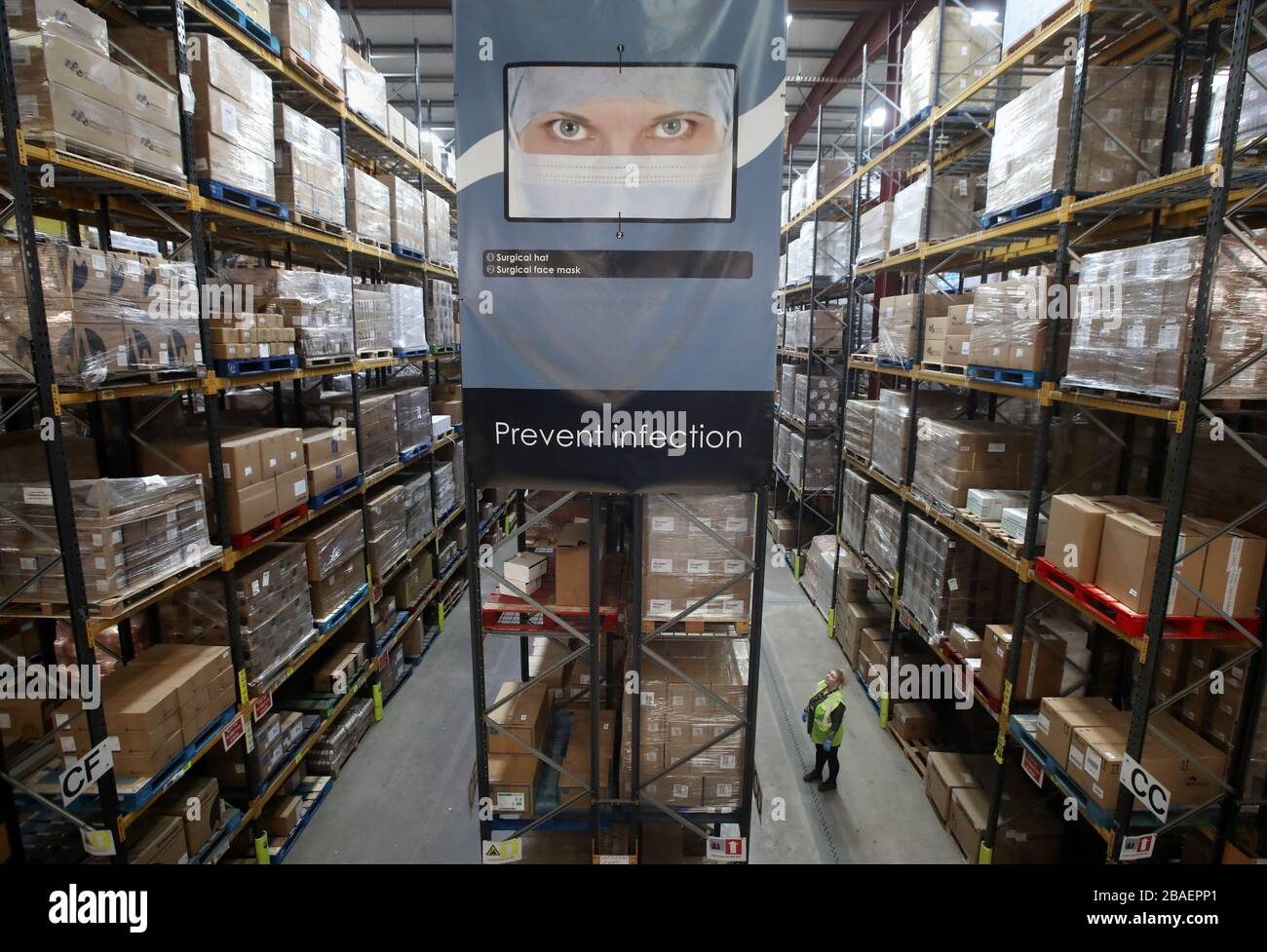 Workers on the warehouse floor gather supplies at the NHS' National ...