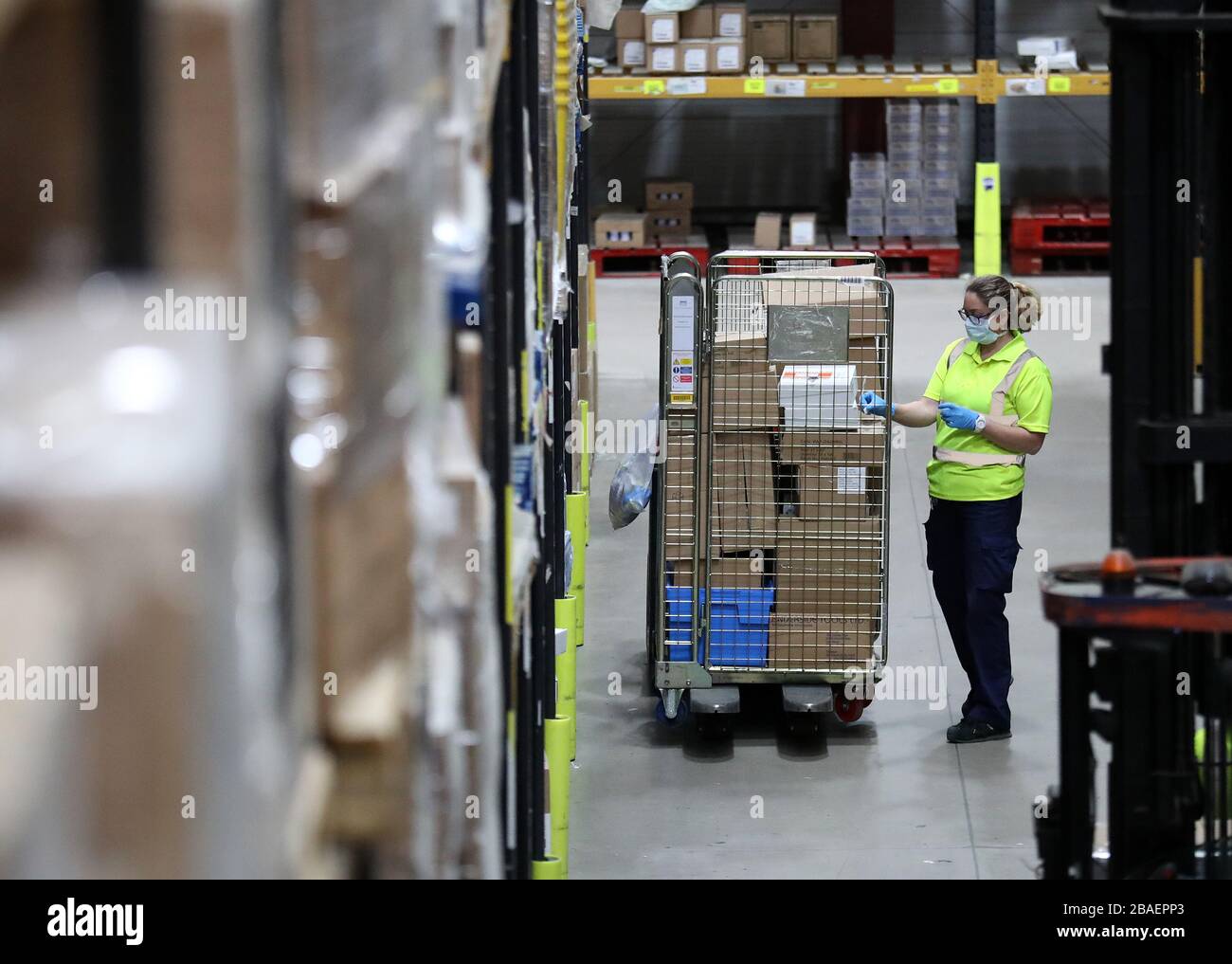 A worker gather supplies at the NHS' National Procurement Warehouse at ...
