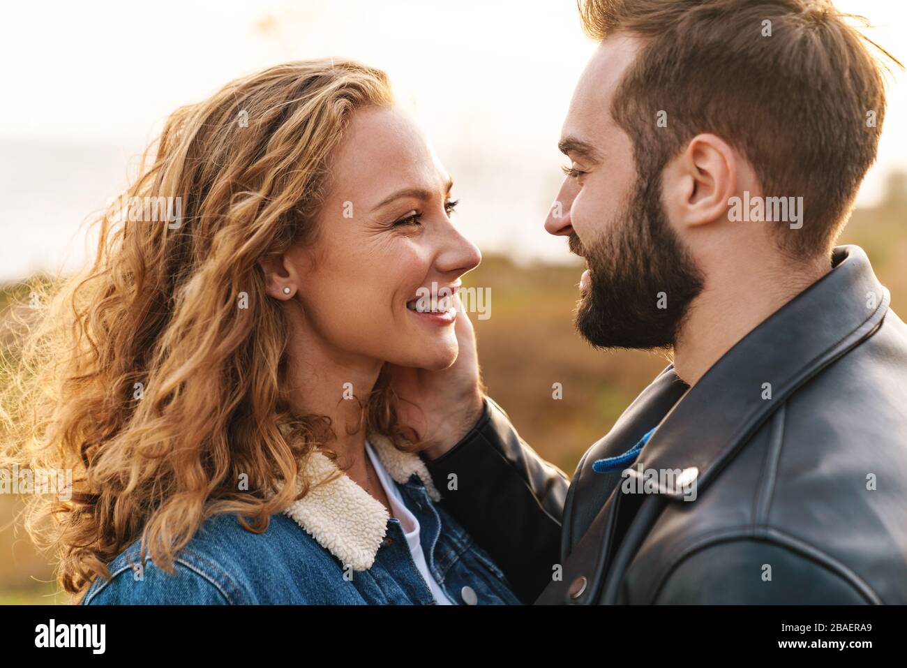 Image of beautiful young caucasian couple dating and walking together ...