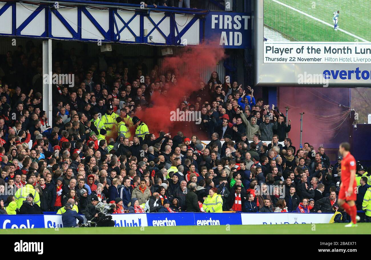Police deal with an incident in the stands as a flare is let off Stock ...