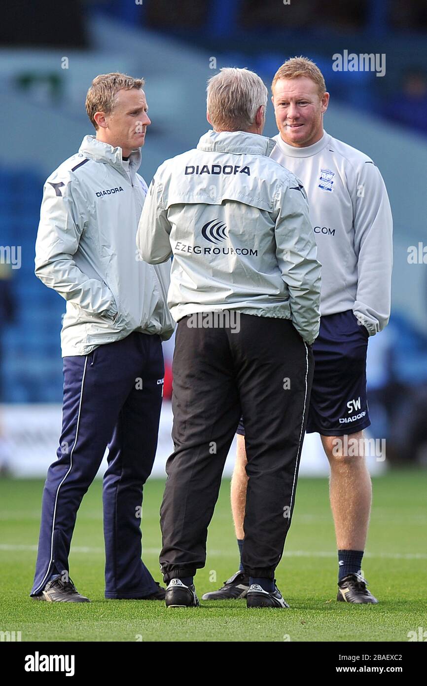 Birmingham City coach Steve Watson (right) speaks with development ...