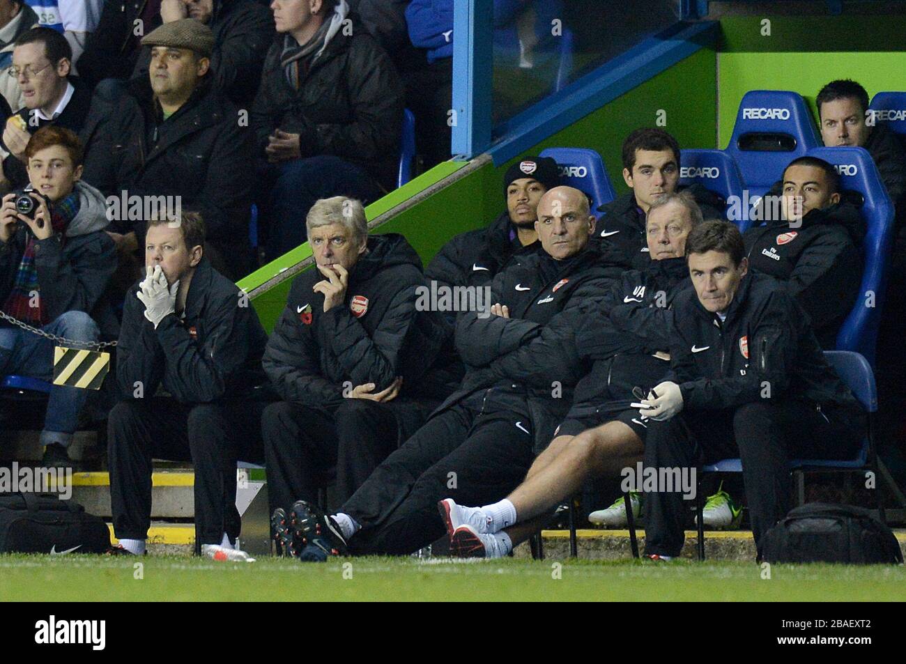 Arsenal Arsene Wenger (centre) and his staff look dejected in the ...
