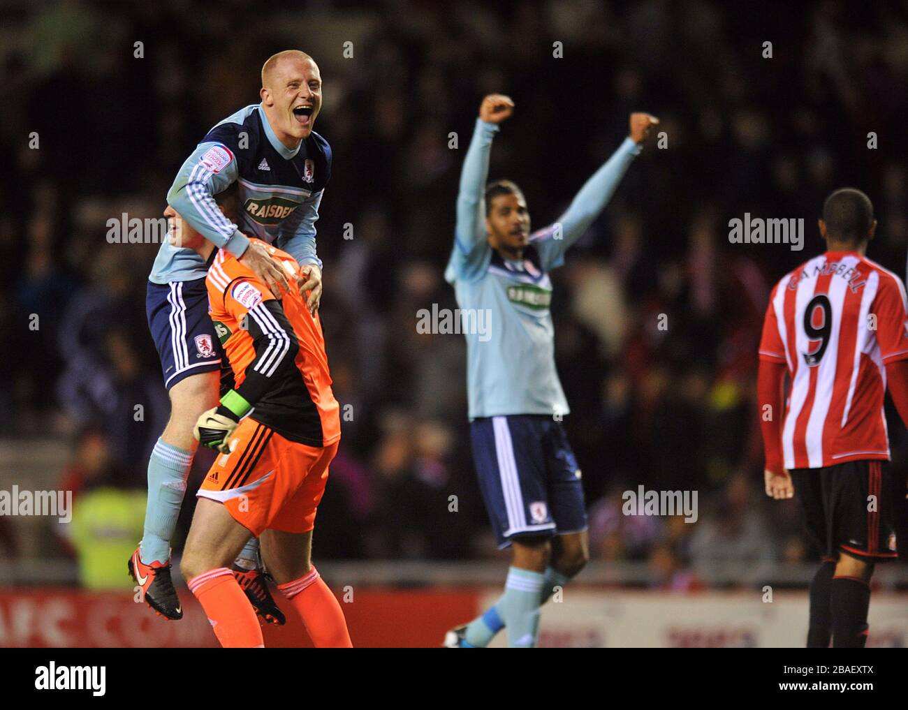 Middlesbrough's Nicky Bailey (top) celebrates with his team-mates after ...