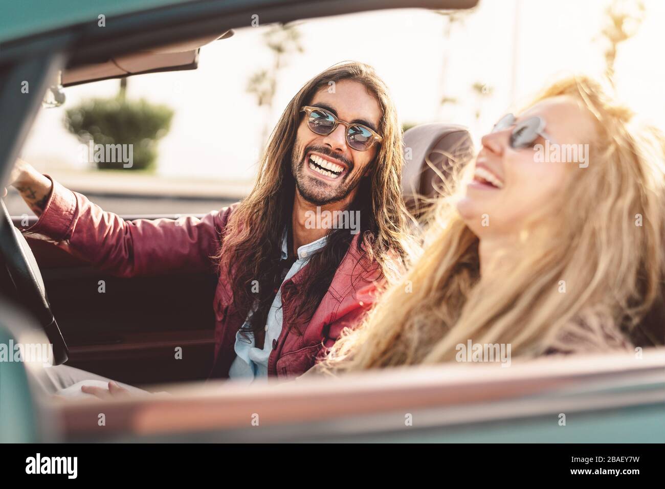 Happy young couple doing road trip in tropical city - Travel people ...