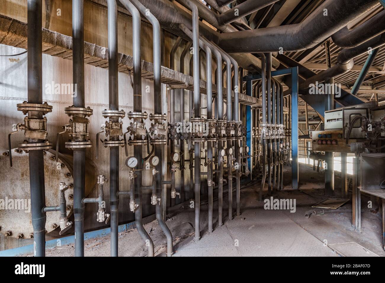 Interior of an old abandoned industrial steel factory Stock Photo - Alamy