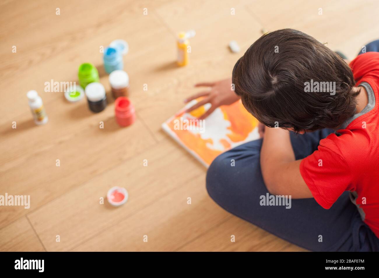 young boy happily doing arts and crafts at home Stock Photo - Alamy