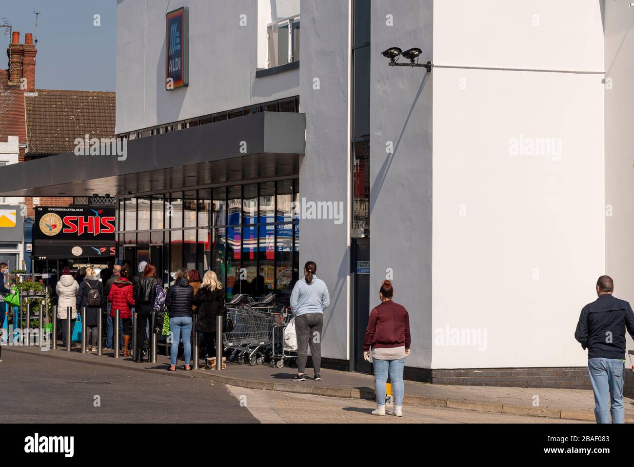 Shoppers queuing outside Aldi superstore in Westcliff on Sea during ...