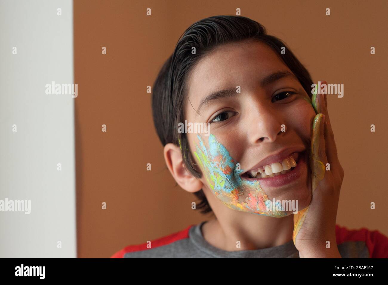 young boy happily doing arts and crafts at home Stock Photo - Alamy