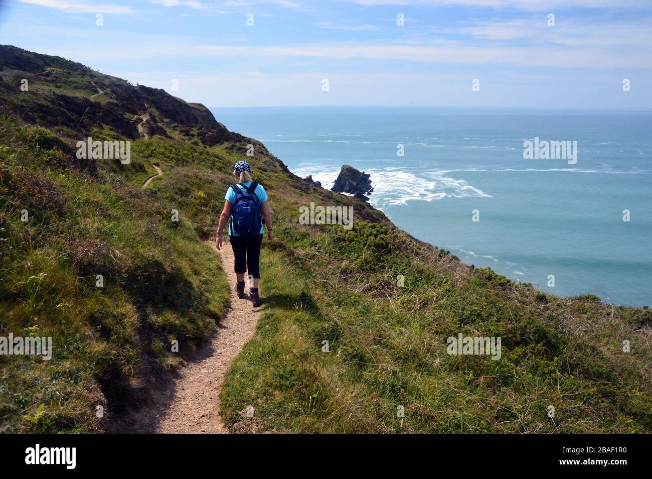 Single Lone Woman Hiker Walking on Clifftop between Welcome Mouth ...
