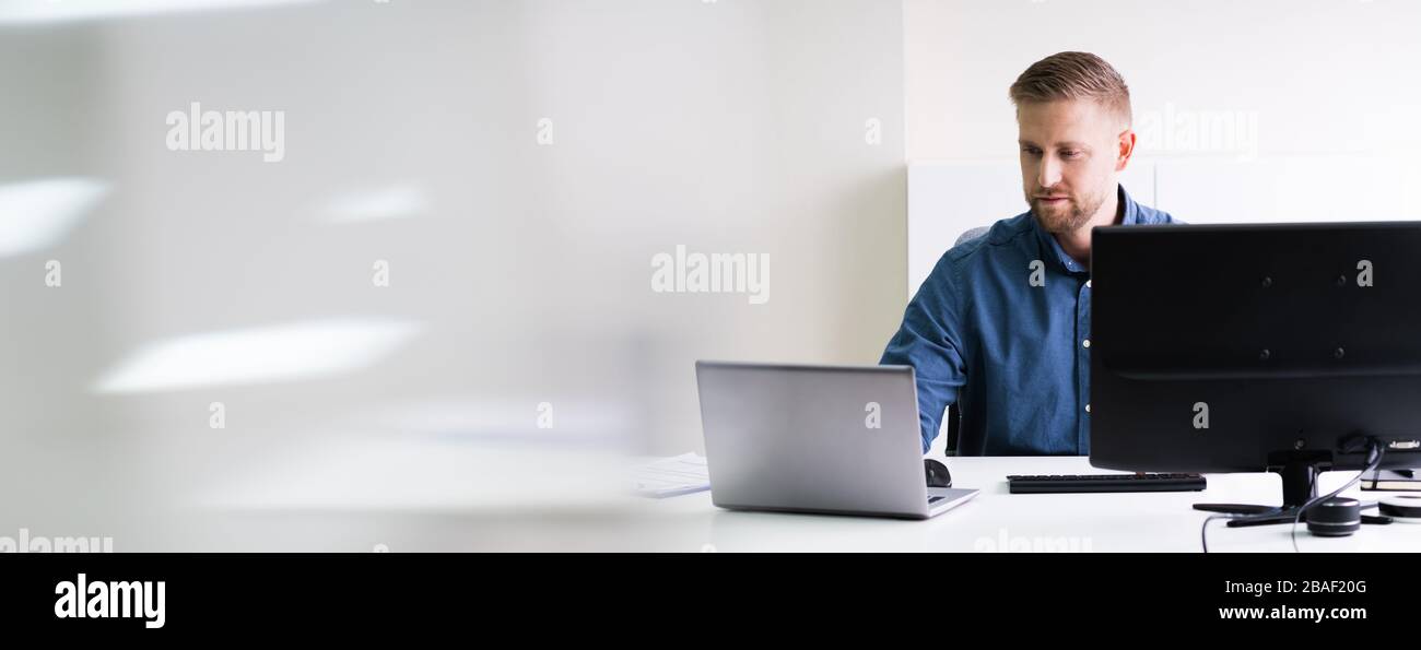Man Working On Laptop Computer Doing Business Stock Photo - Alamy