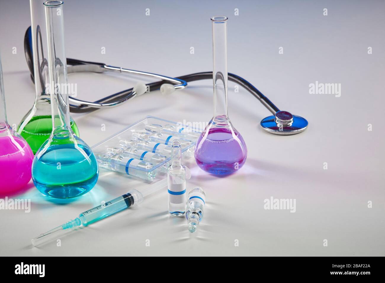 Four medical flasks with colorful chemical reagents. Seven mockup ...