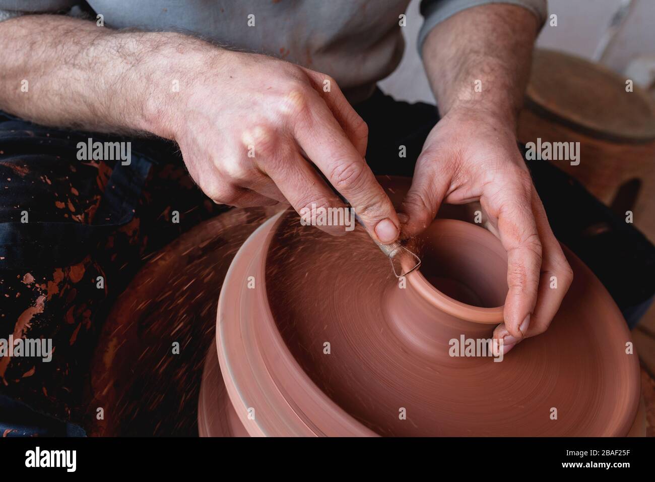 Professional potter making bowl in pottery workshop, studio Stock Photo ...
