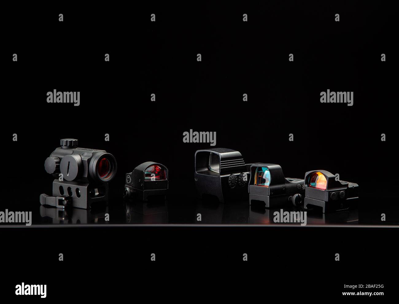 Different modern optical collimator sights on dark background. Sights ...