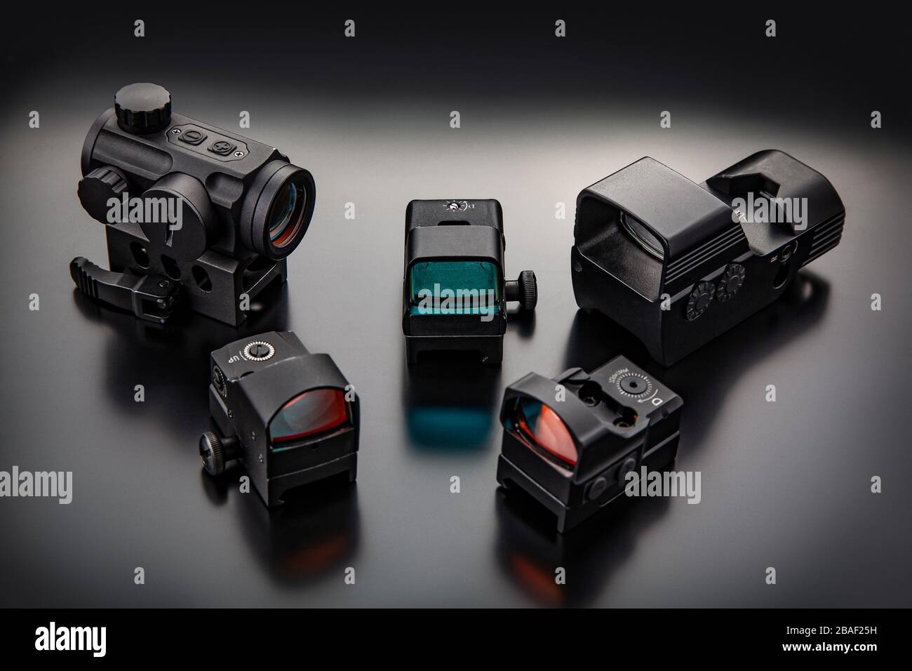 Different modern optical collimator sights on dark background. Sights ...