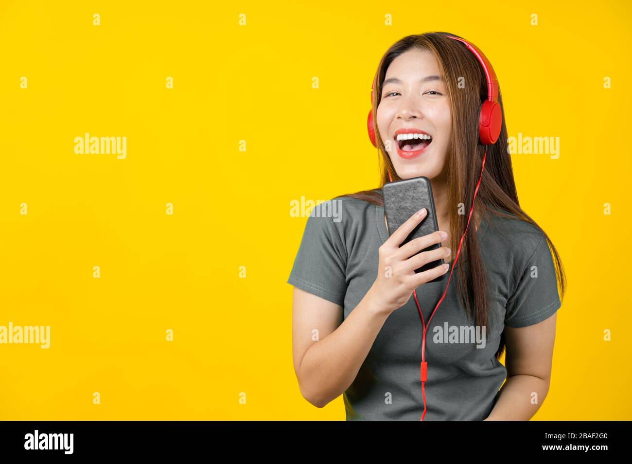 Happiness Asian smiling young woman wearing technology wireless ...
