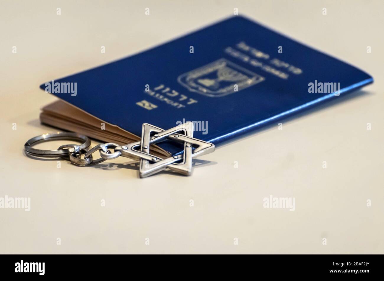 A blue passport of the State of Israel with a Star of David key chain ...