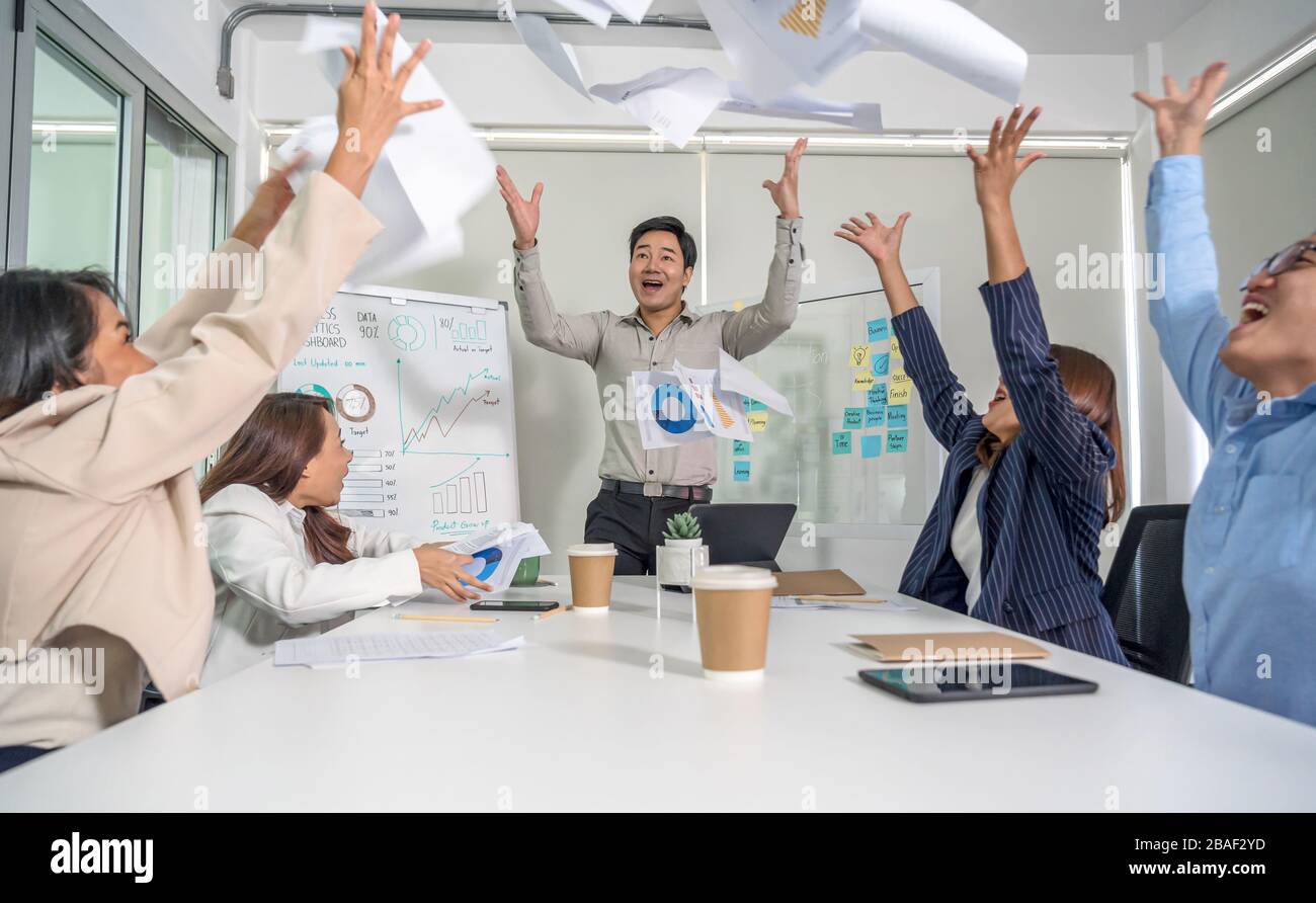 Group Of Asian Business people throwing paper document together with ...