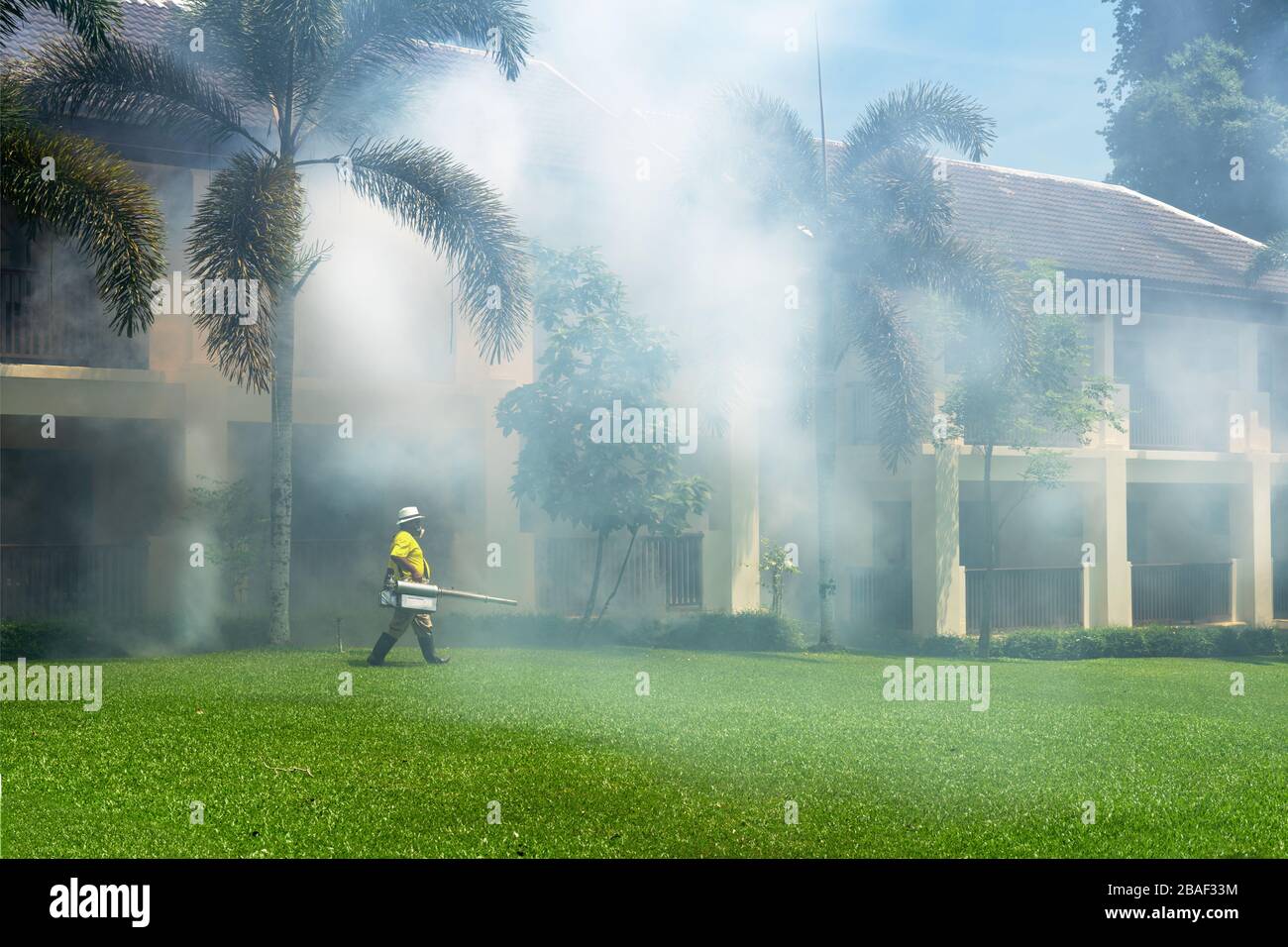 Man sprinkling pesticides hi-res stock photography and images - Alamy