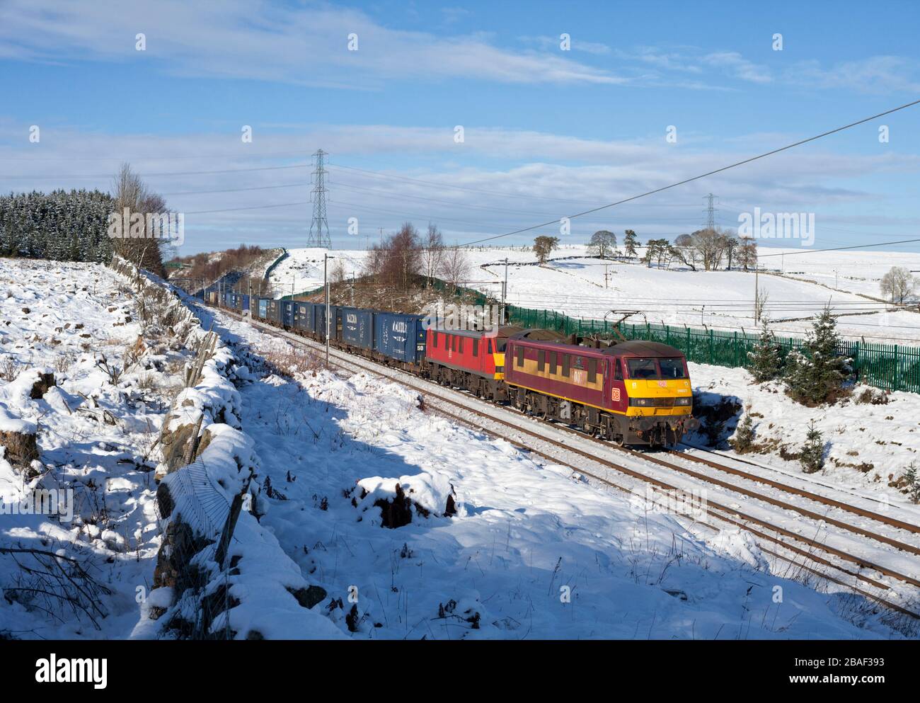 2 DB Cargo UK class 90 electric locomotives passing Shap Summit on the ...