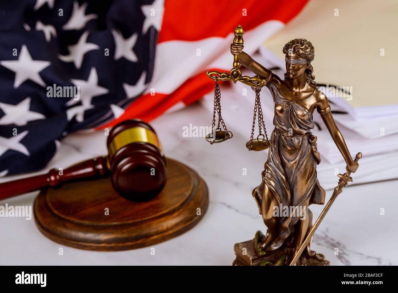 Figure of Justice holding the scales of justice with gavel on a law ...