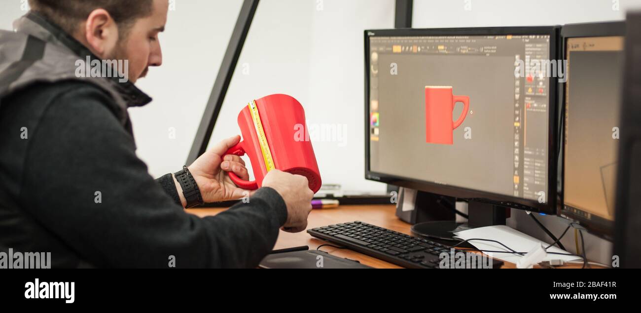 Graphic designer and 3d program animator work at computer in the office ...