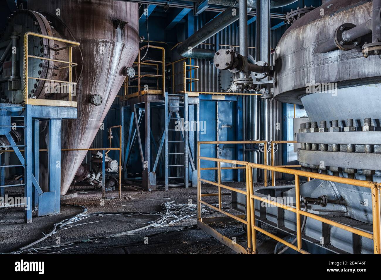 Interior of an old abandoned industrial steel factory Stock Photo - Alamy