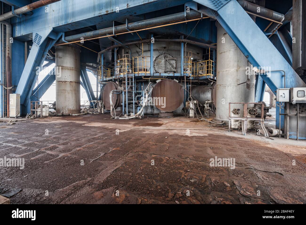 Interior of an old abandoned industrial steel factory Stock Photo - Alamy