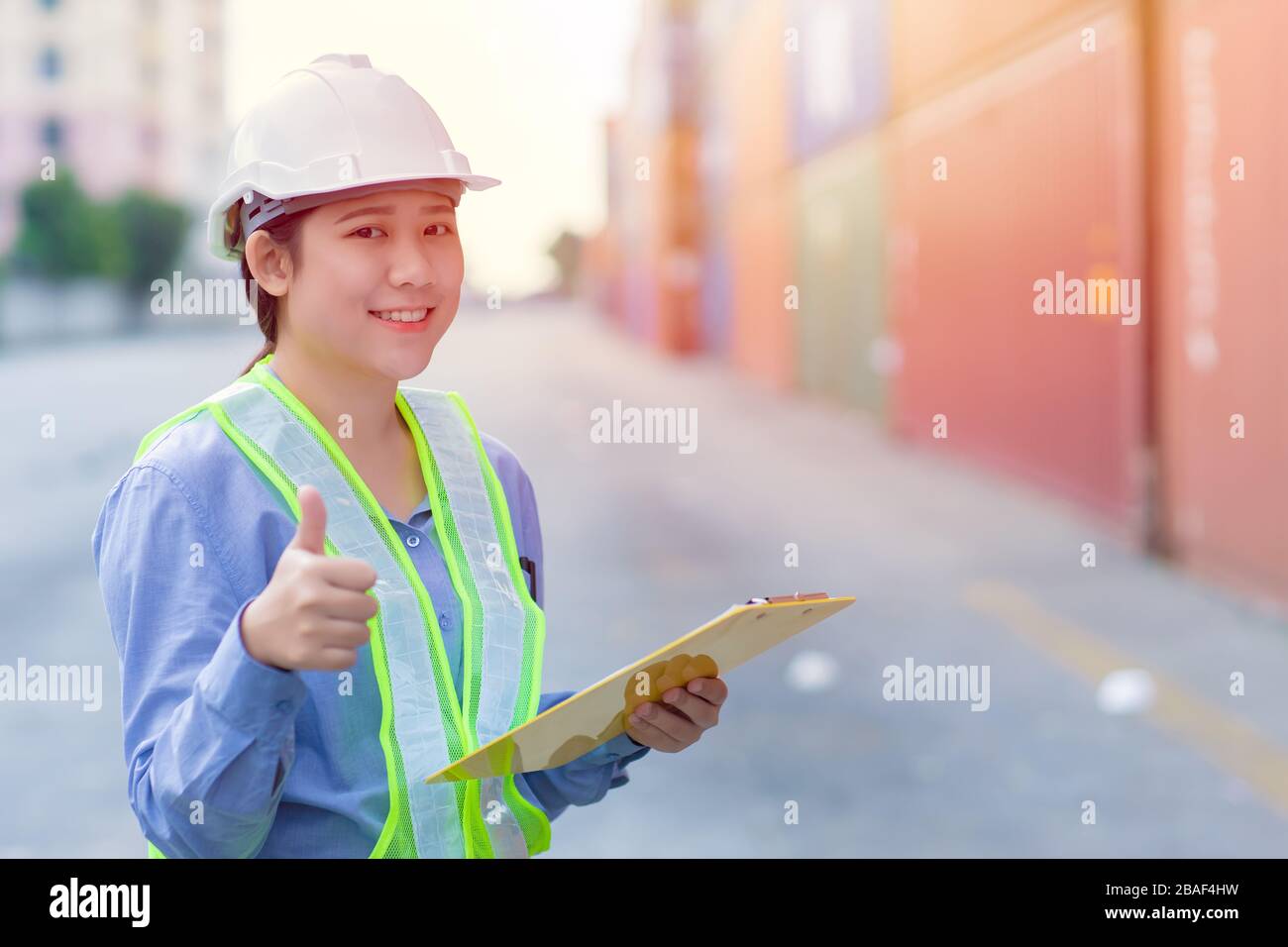 shipping worker show thumbs up sign for good work job done with ...