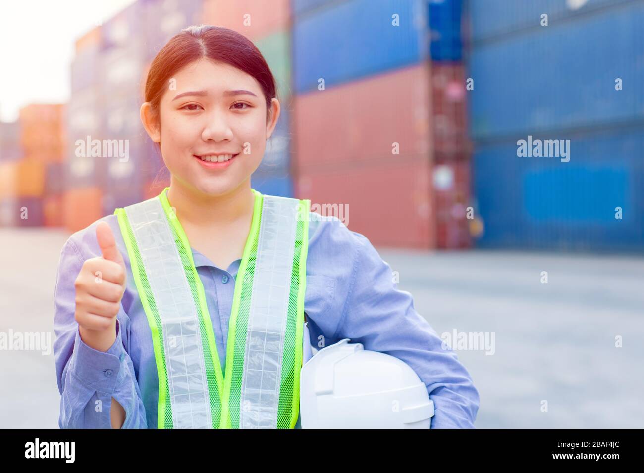 shipping worker show thumbs up sign for good work job done with ...