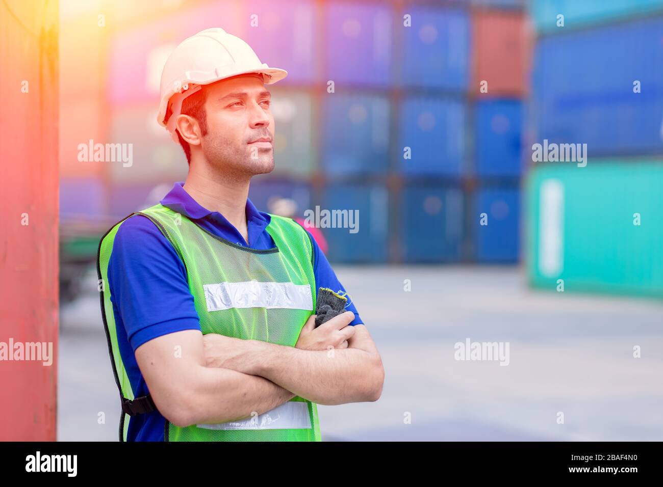 portrait of shipping worker man proud of work in cargo port for import ...