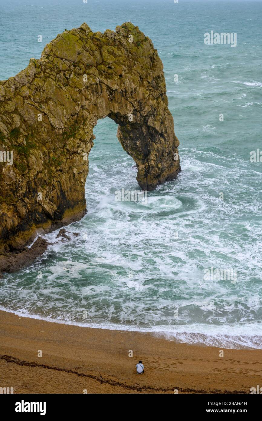 Durdle Door in Dorset with tidal whirlpool (portrait format Stock Photo ...