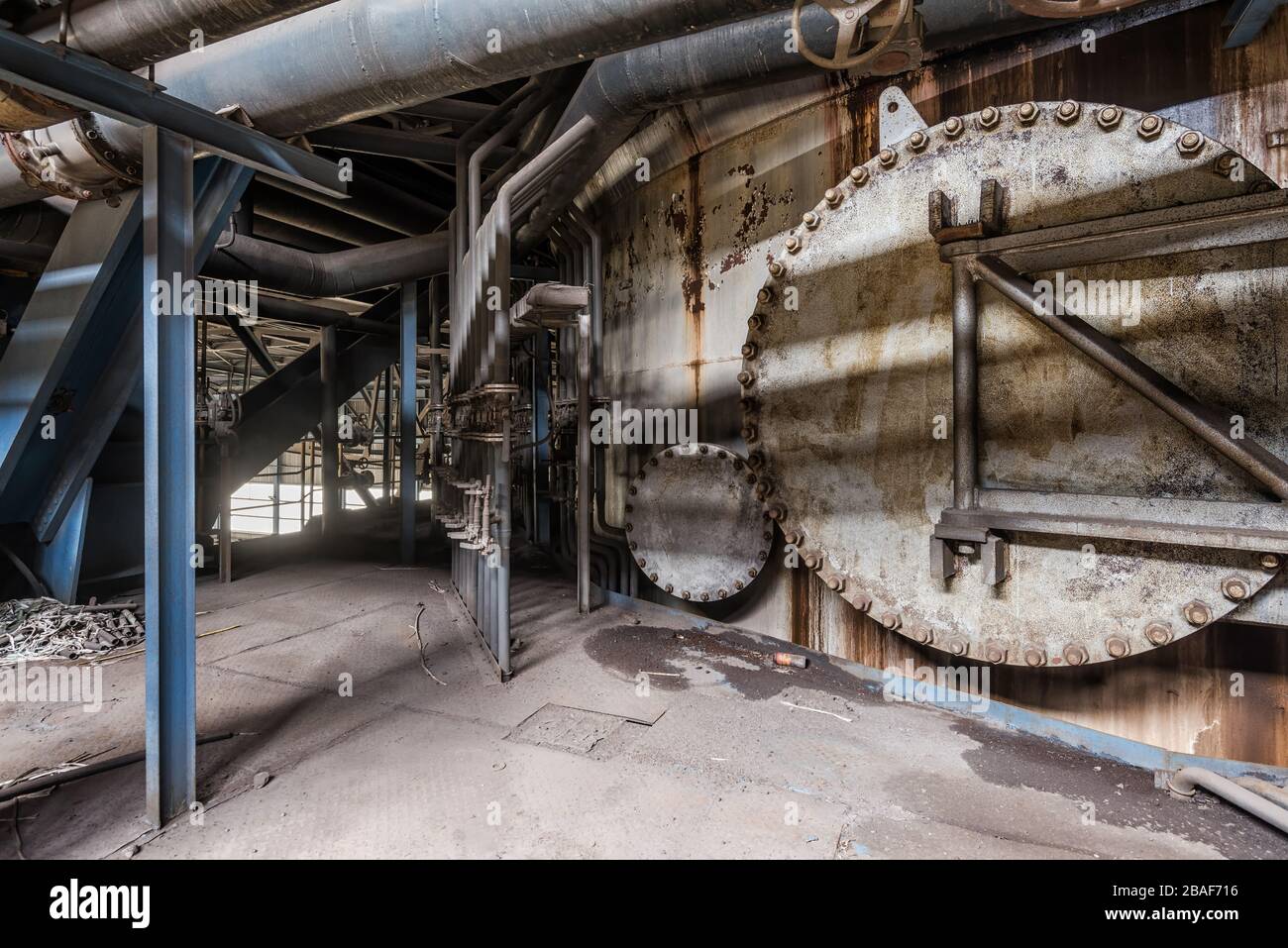 Interior of an old abandoned industrial steel factory Stock Photo - Alamy