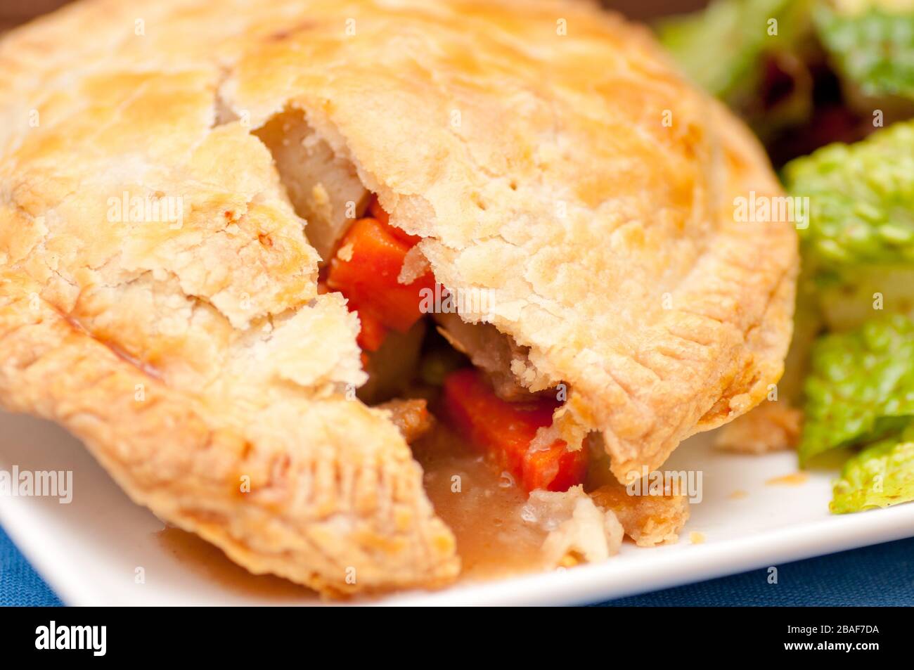 A meat pie with side salad Stock Photo - Alamy