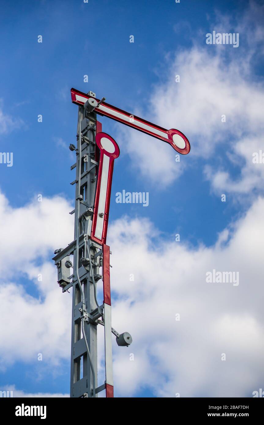 Old German semaphore railway signal against a cloudy blue sky Stock ...