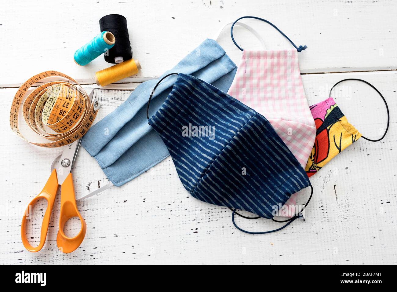 Homemade protective masks made of cotton due to coronavirus on table ...