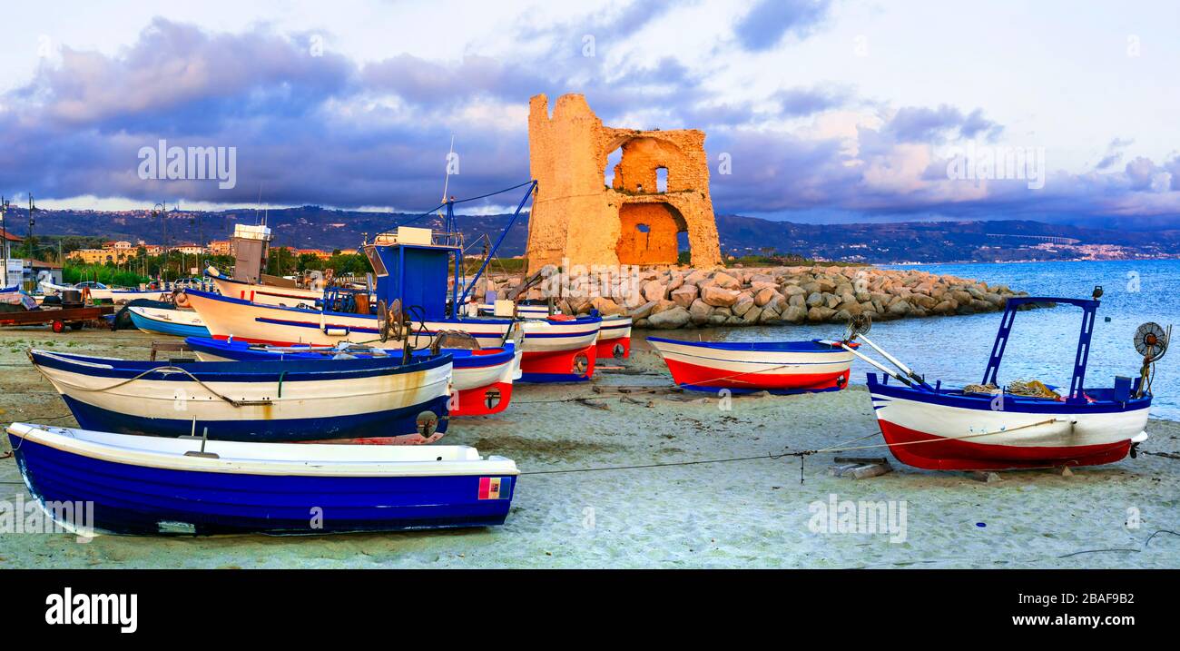 Traditional fishing boats,sea and Saracen tower,Briatico village ...