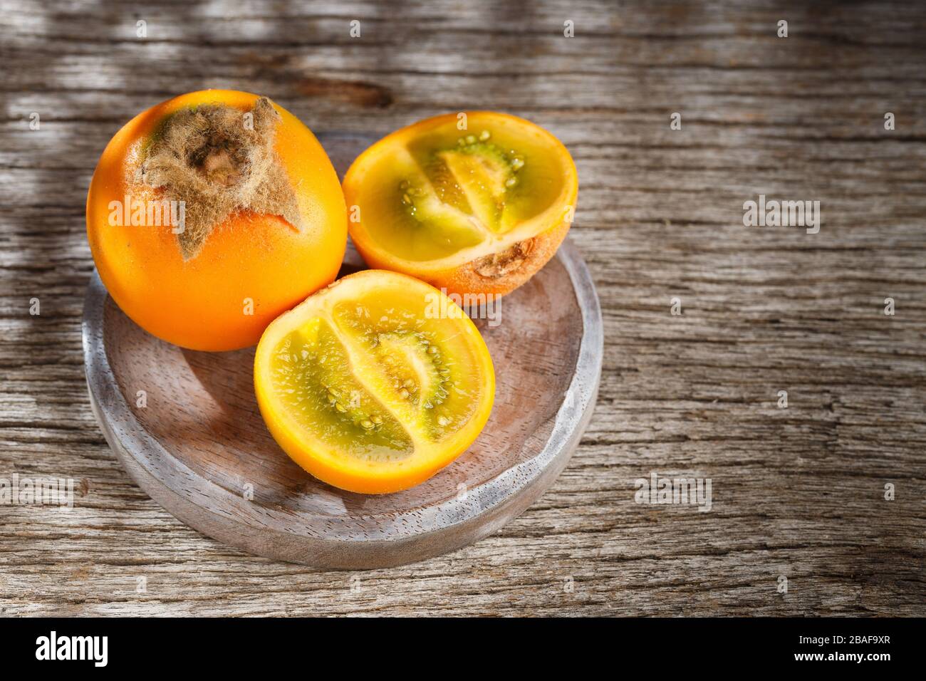 Fruit of lulo or naranjilla on wood subtropical perennial plant of ...