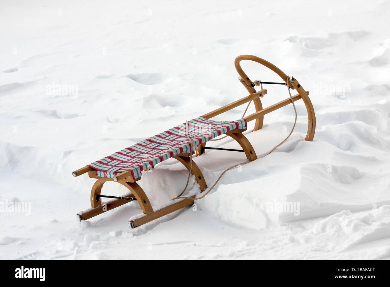 wooden sledge on snow in winter Stock Photo - Alamy