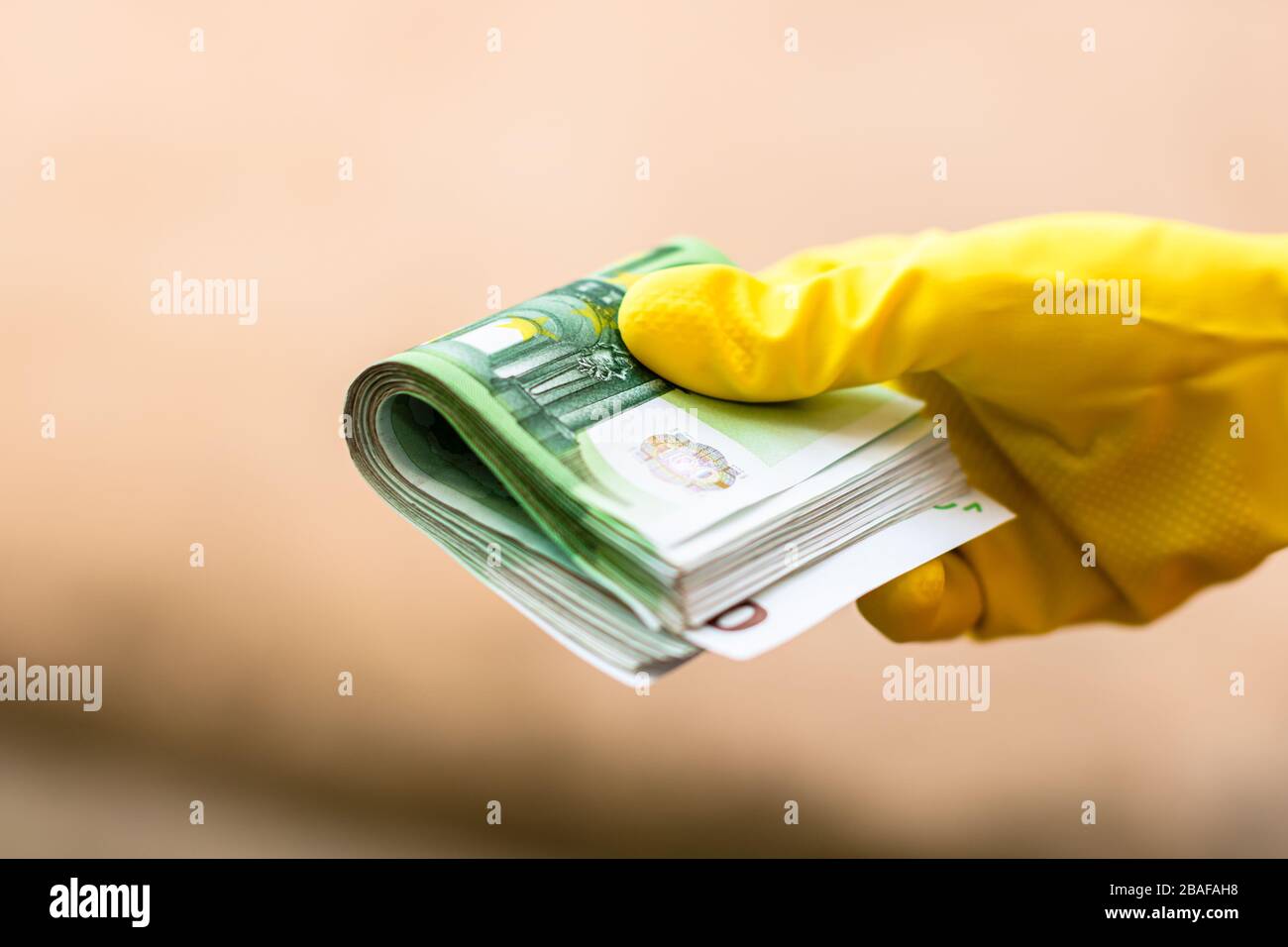 World money concept, hand with gloves receiving, giving or holding 100 ...