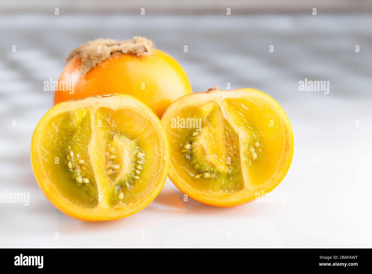 Lulo or naranjilla fruit on white, subtropical perennial plant of ...