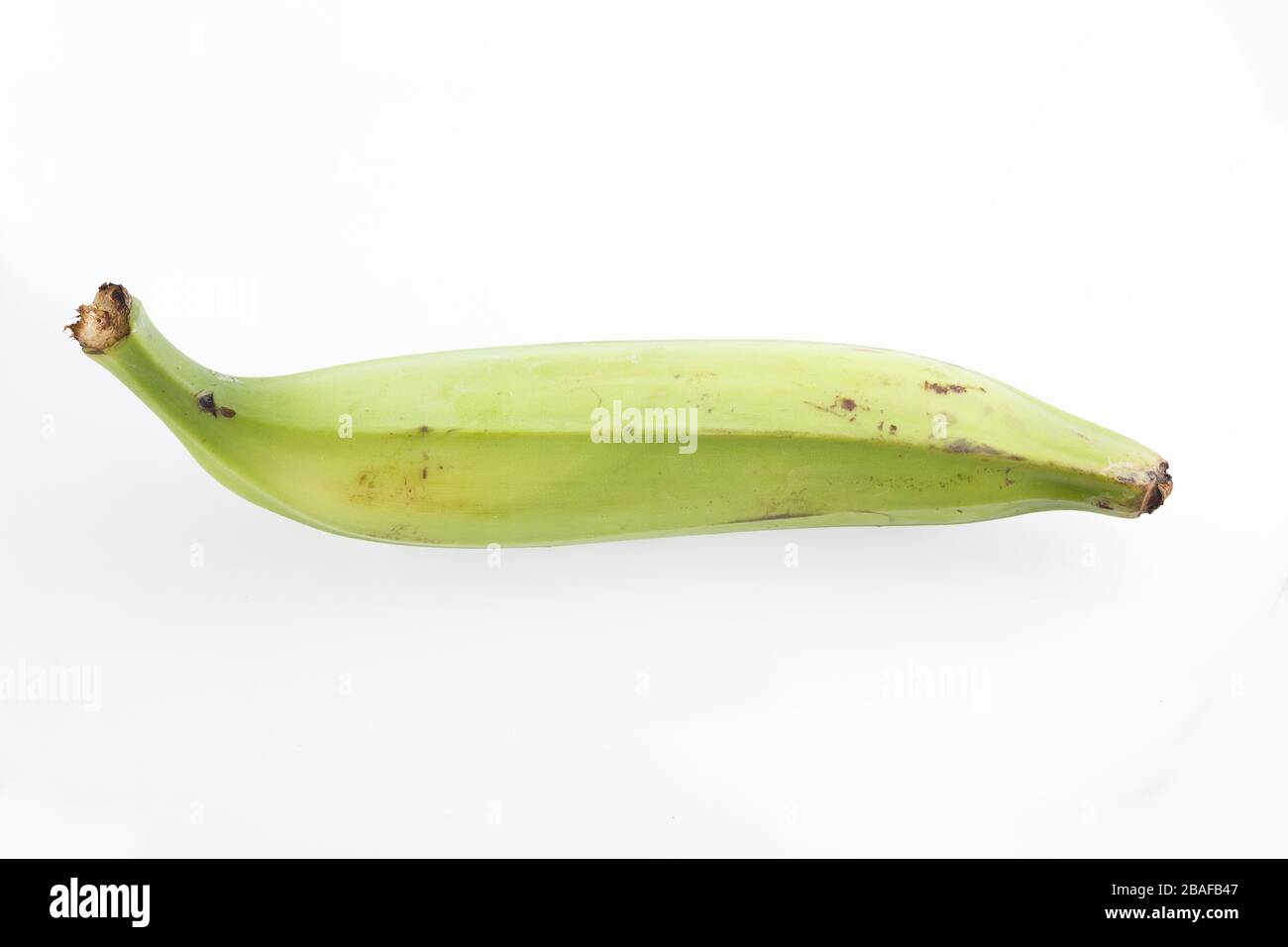 green banana on white background, close-up image Stock Photo - Alamy
