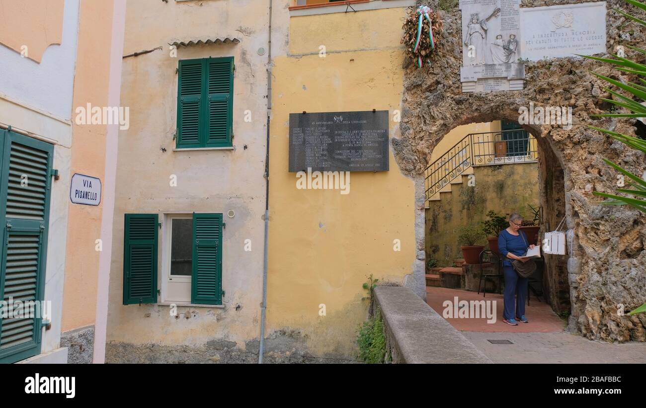 Commemorative plaques and memorial in the old town of Ameglia, La ...