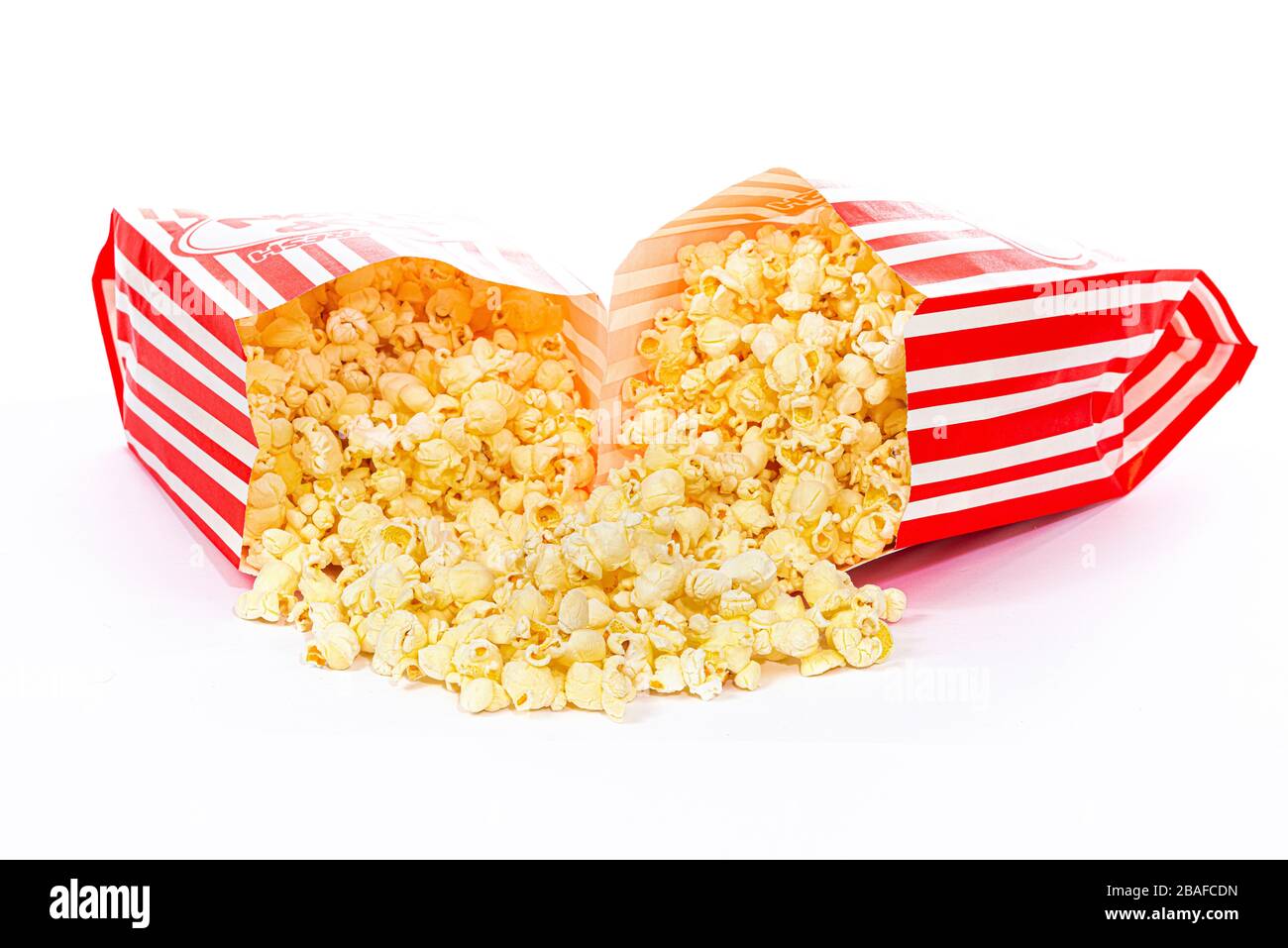 Horizontal shot of two bags of popcorn laying toward each other ...