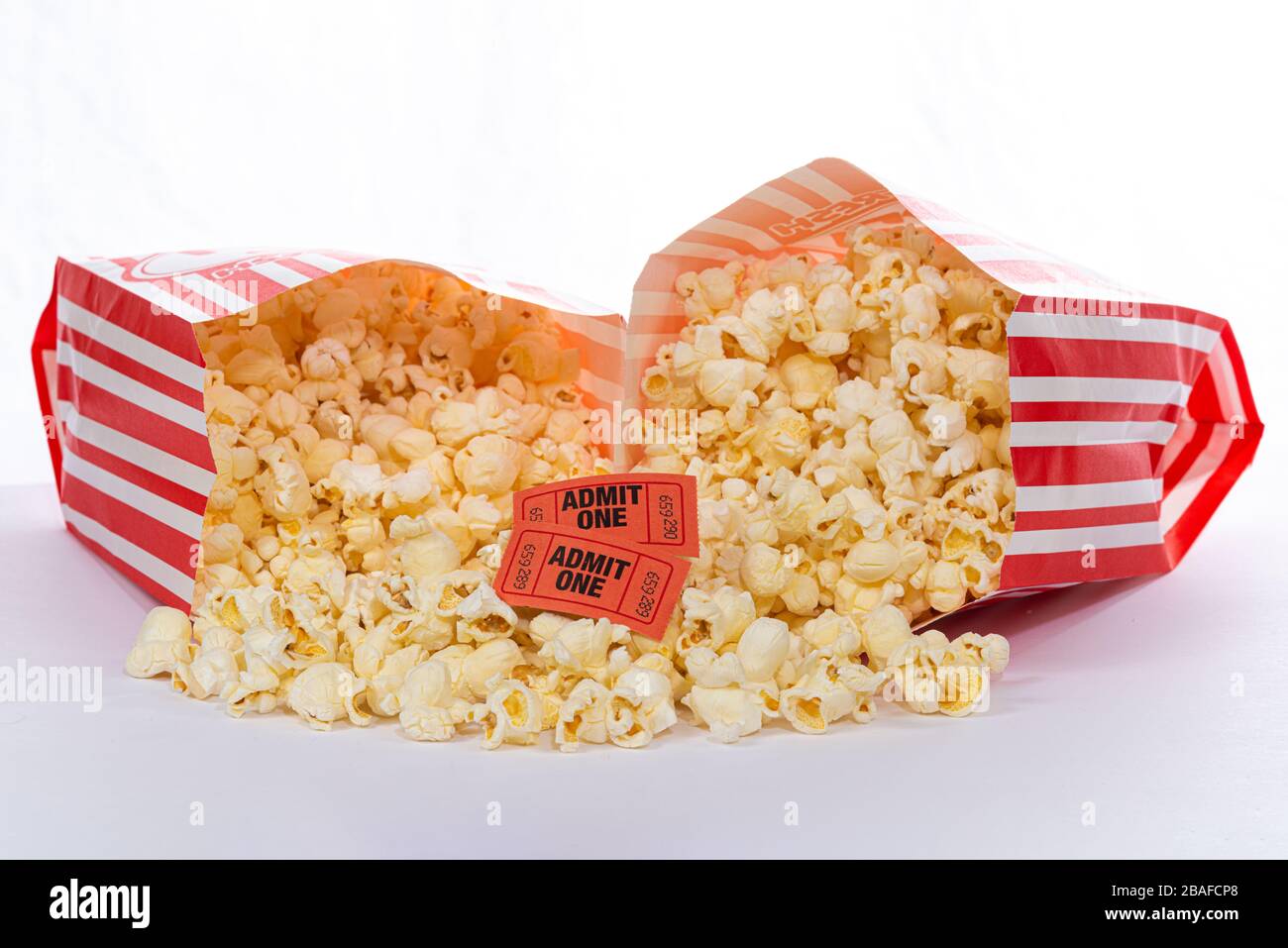 Horizontal shot of two bags of popcorn laying toward each other ...