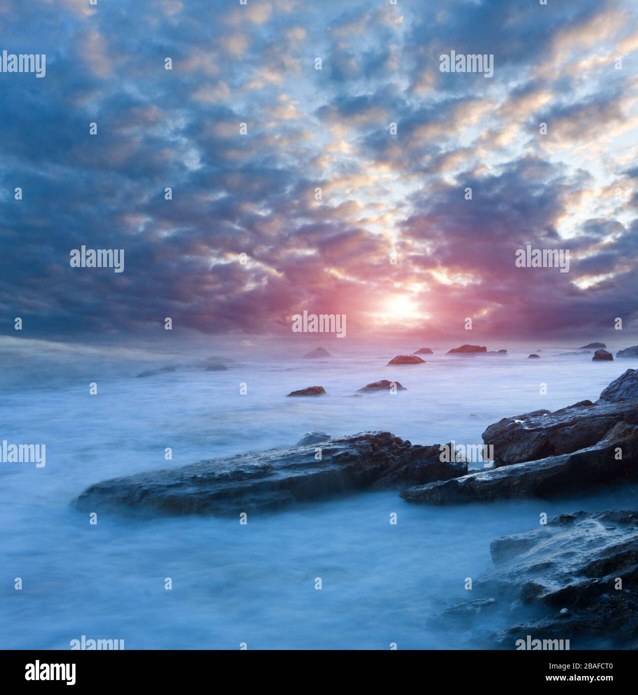 Evening scene on sea shore Stock Photo - Alamy