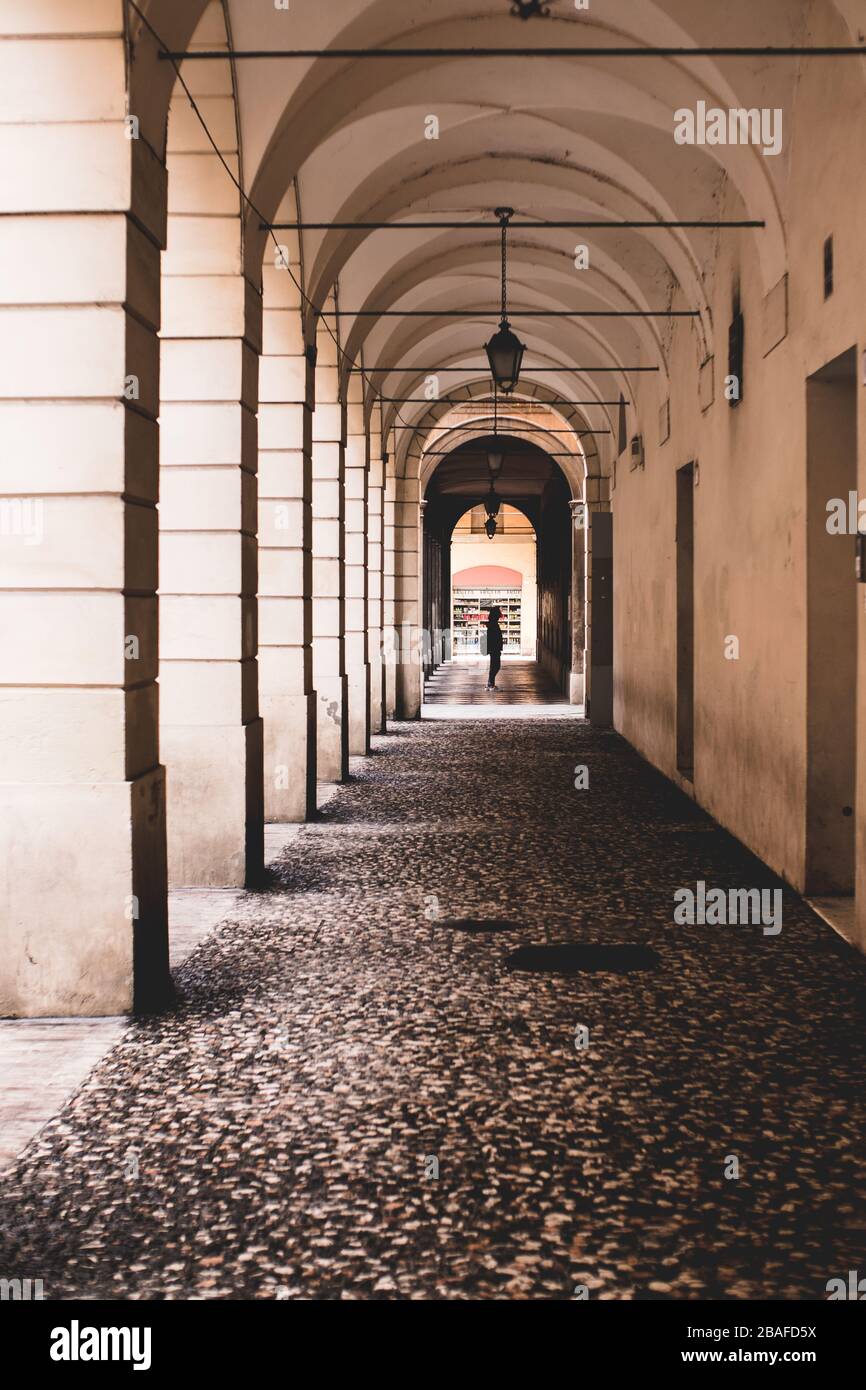 Vertical shot of a hallway with concrete columns Stock Photo - Alamy