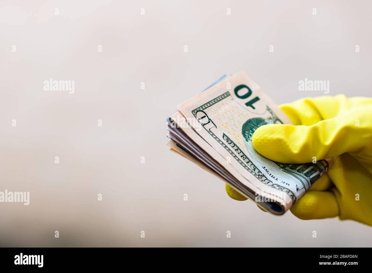 World money concept, hand with gloves receiving, giving or holding USD ...