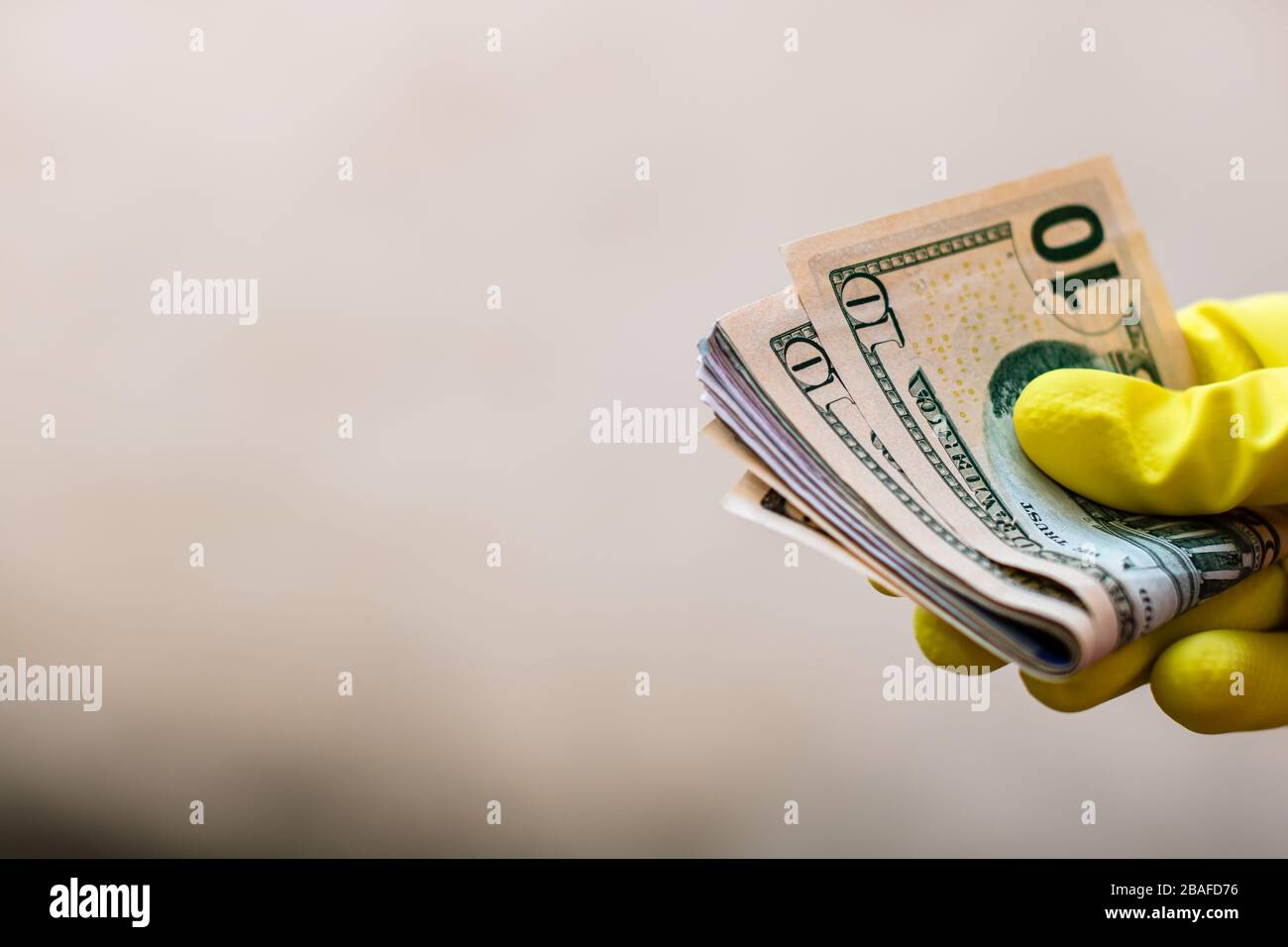 World money concept, hand with gloves receiving, giving or holding USD ...
