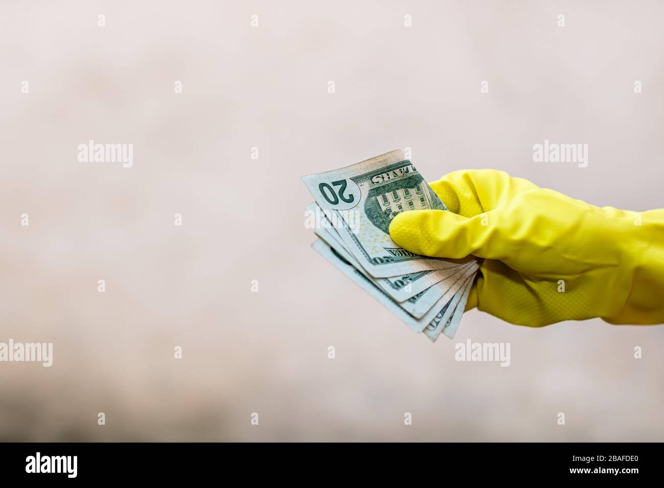 World money concept, hand with gloves receiving, giving or holding 20 ...
